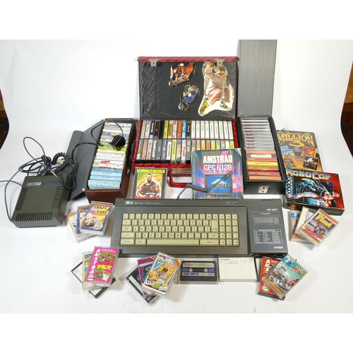 An Amstrad 128K personal computer together with a MP2 Amstrad module ...