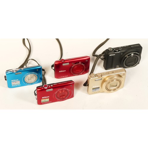 Five Nikon compact digital cameras, to include Coolpix S9100, S3600 ...