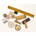 A collection of small folding rules tape measures advertising items and ...