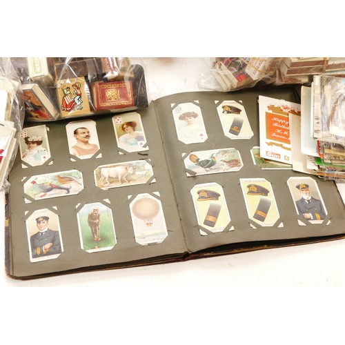 A collection of mid 20th century and later cigarette packets, cards ...
