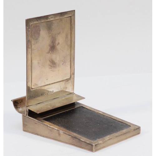 Asprey, a silver note pad and pen holder, London 1970, with spring ...