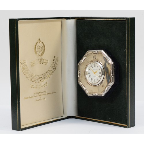 A silver mounted quartz desk clock, London 1996, crest of an Iraqi ...