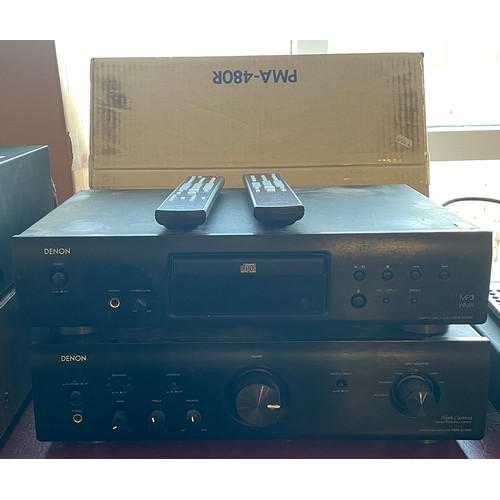 A Denon Hi-FI amplifier PMA-510AE, together with a Denon compact disc ...