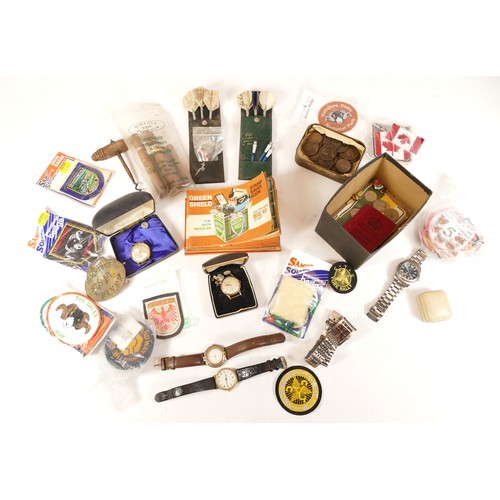 An assortment of collectable items, to include, watches, darts, and old ...