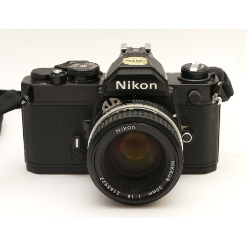 A Nikon SLR film camera, model no. FM 3312322, with Nikon Nikkor f/1.8 ...