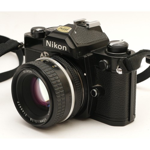 A Nikon SLR film camera, model no. FM 3312322, with Nikon Nikkor f/1.8 ...