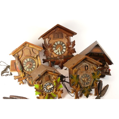 A collection of mid-twentieth century Black Forest cuckoo clocks ...
