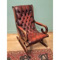 A 20th century Chesterfield style slipper rocking chair, with open ...