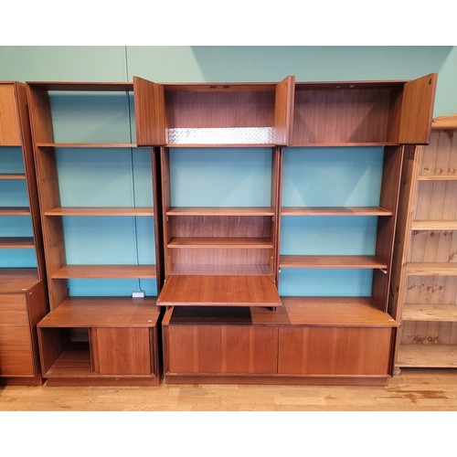 G-Plan; A mid 20th century teak three-section modular wall unit, top ...