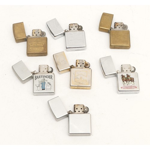 A collection of seven Zippo pocket cigarette lighters, chrome, steel ...