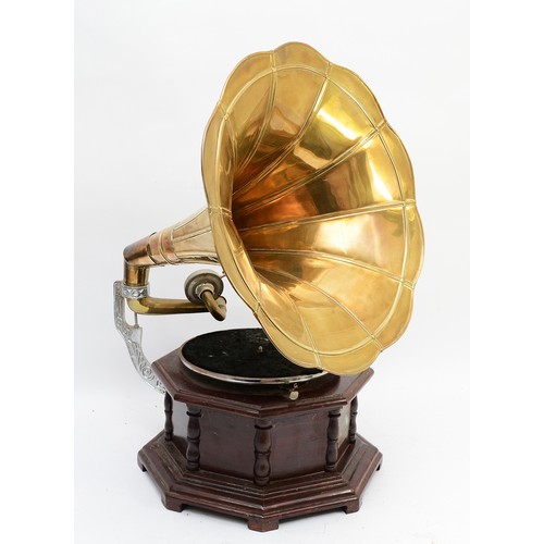 A HMV reproduction wind-up gramophone, the octagonal wooden case with ...