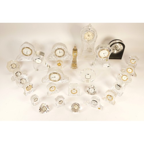 A selection of crystal glass mantel clocks, bedside clocks and ...