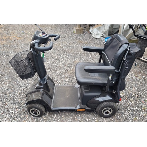 A Vantage X four wheeled mobility scooter, with key and charger ...