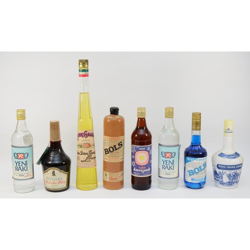 A selection of eight bottles of various liqueurs and spirits, to ...