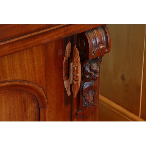 A Victorian mahogany cylinder writing desk, the roll top enclosing ...