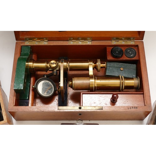 An early 20th century microscope in fitted mahogany case, together with ...
