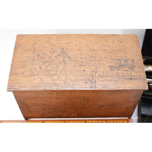 A wooden box, decorated with Pokerwork text, housing a cribbage board ...