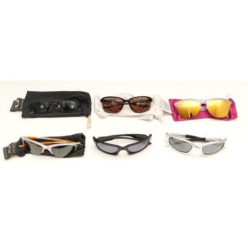 Six pairs of Oakley designer sunglasses. (6)