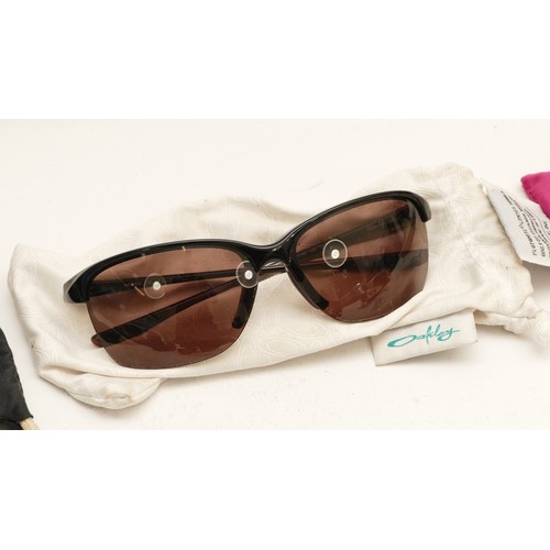 Six pairs of Oakley designer sunglasses. (6)