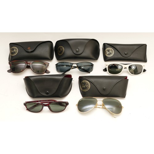 Five cased pairs of Ray-Ban designer sunglasses.