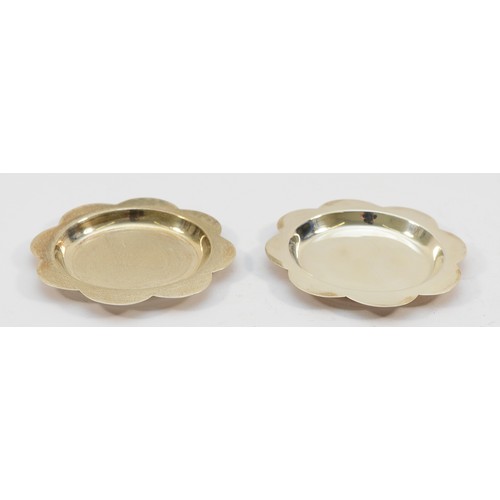 A matching pair of 925 silver trinket trays, having scalloped edge ...