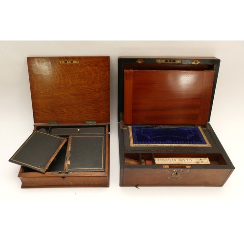 Two Edwardian writing slopes, comprising of a mahogany and an oak ...