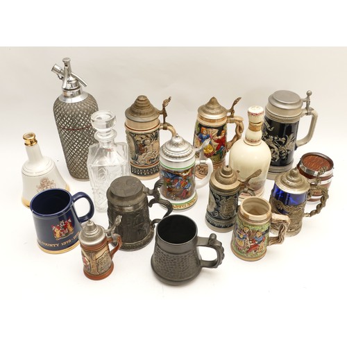 A collection of 20th century ceramic Steins, of various sizes having ...