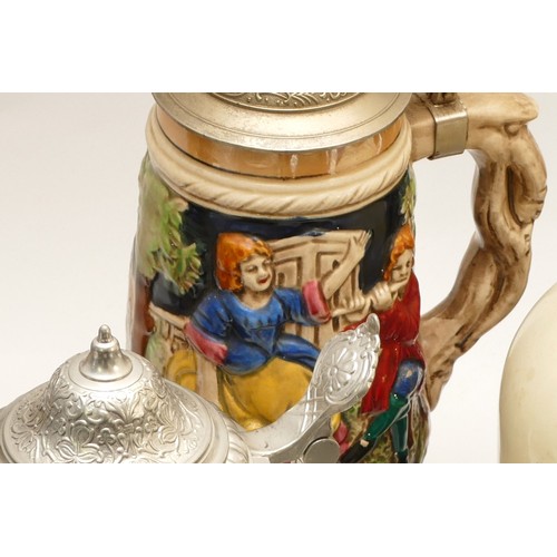 A collection of 20th century ceramic Steins, of various sizes having ...