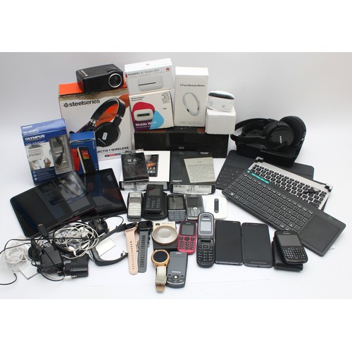 A selection of vintage electronic devices, primarily mobile phones ...