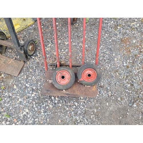 Two railway porter's trolleys, a two-wheeler sack barrow example, and a ...