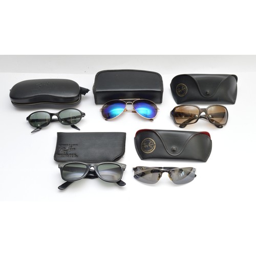 Five cased pairs of Ray-Ban designer sunglasses.
