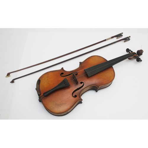 A 19th century full size violin, having two piece humped back, ebony ...