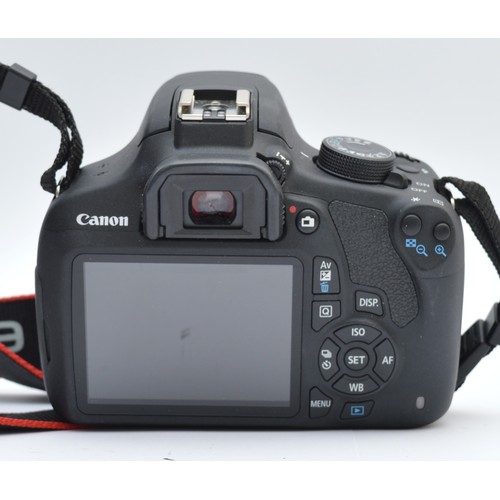 A Canon EOS 500D DSLR camera with an EF-S f/3.5-5.6 18-55mm lens, boxed.