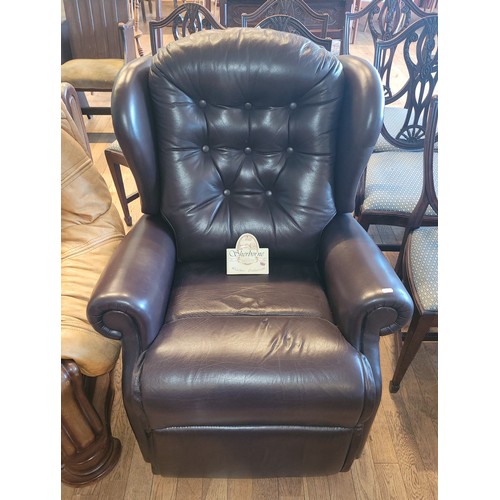 A Sherbourne electric wingback recliner armchair, upholstered in dark ...