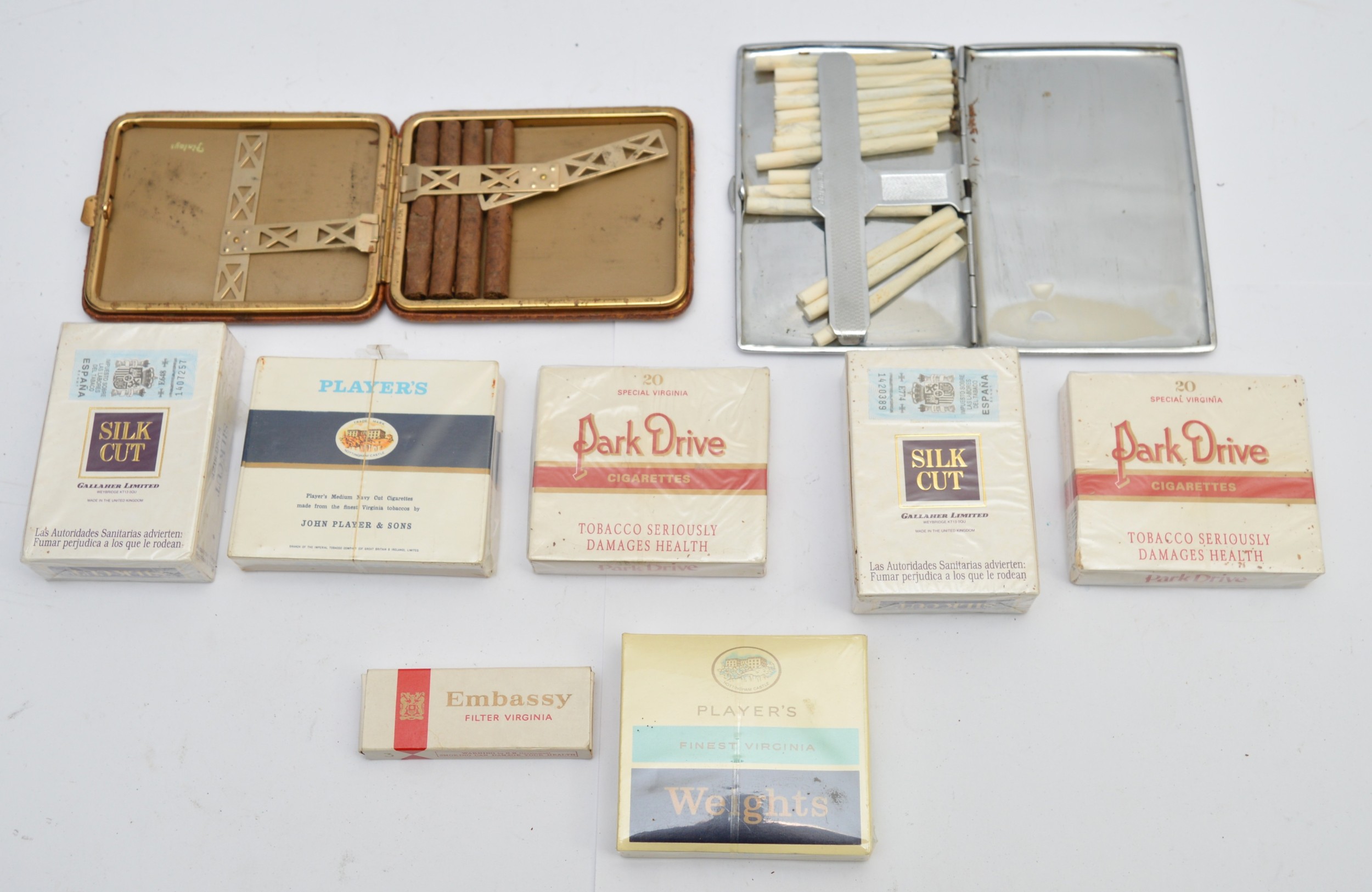A collection of six sealed packets of vintage cigarettes, with one pack ...