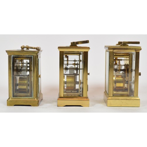 Three late 20th century brass carriage clocks, having enamelled dials ...