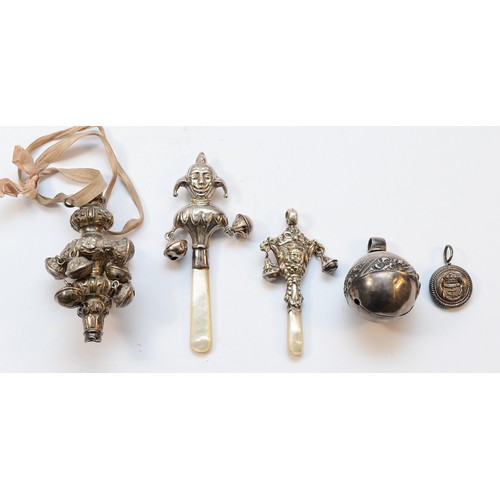 A silver rattle with mother of pearl handle in the form of a Jester ...