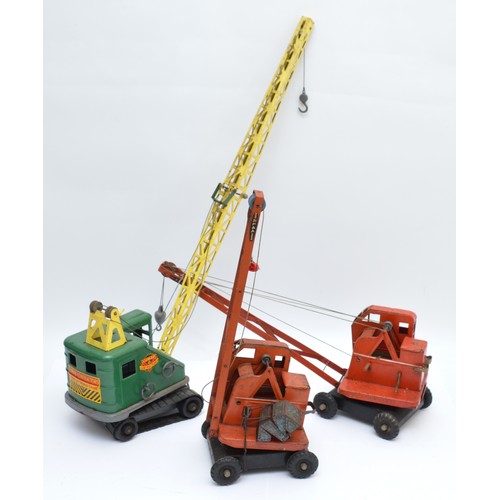 Three vintage model cranes, to include, a tinplate Tri-ang example. (3)