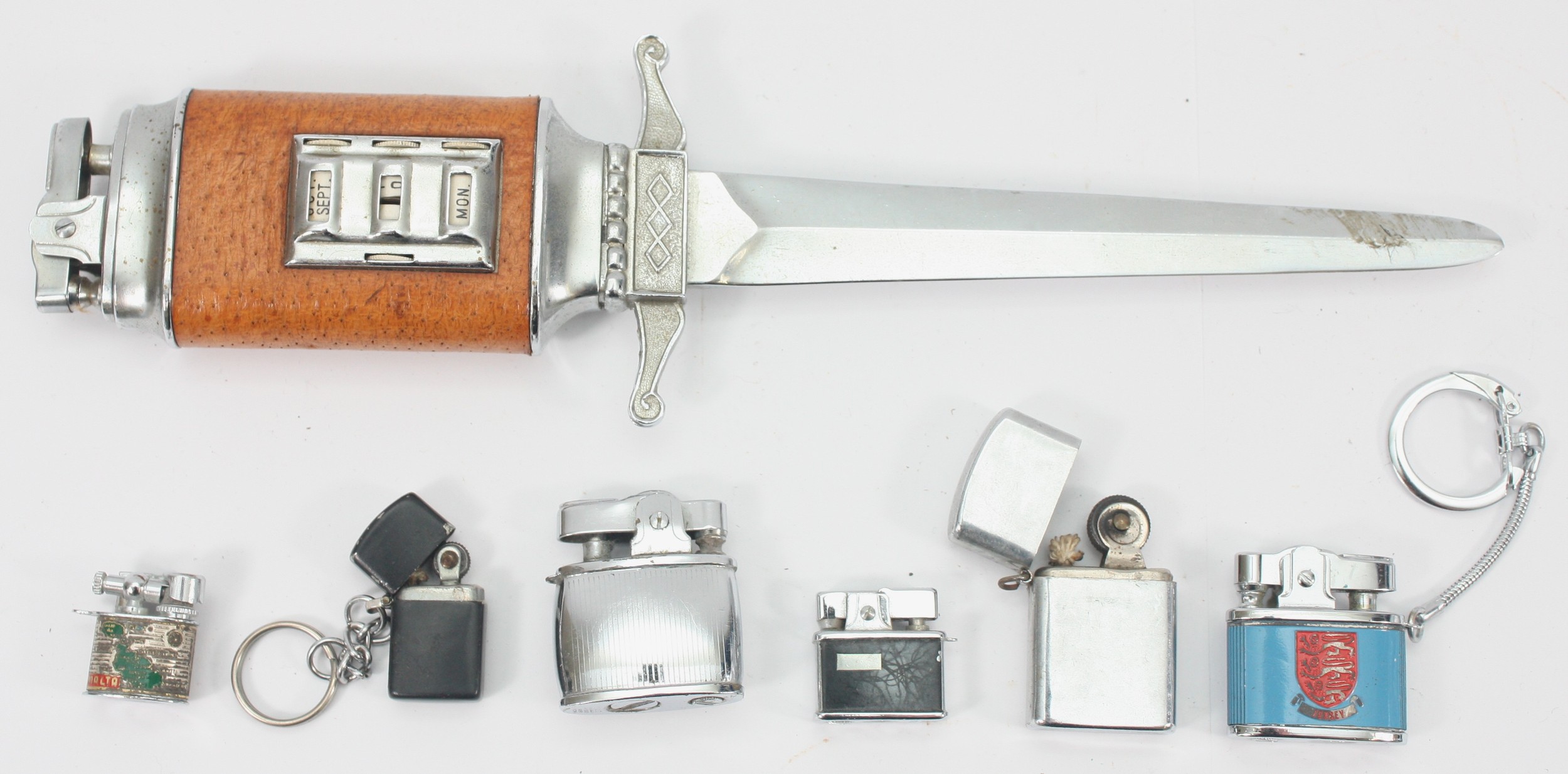 A collection of seven 1950s/60s petrol novelty cigarette lighters ...