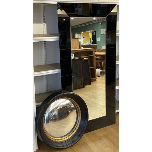 Two contemporary wall mirrors, to include a Libra circular convex or ...