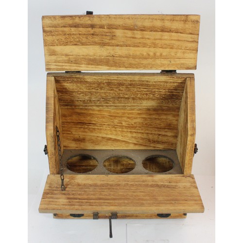An oak hall mirror with an integrated barometer and clothes brushes ...