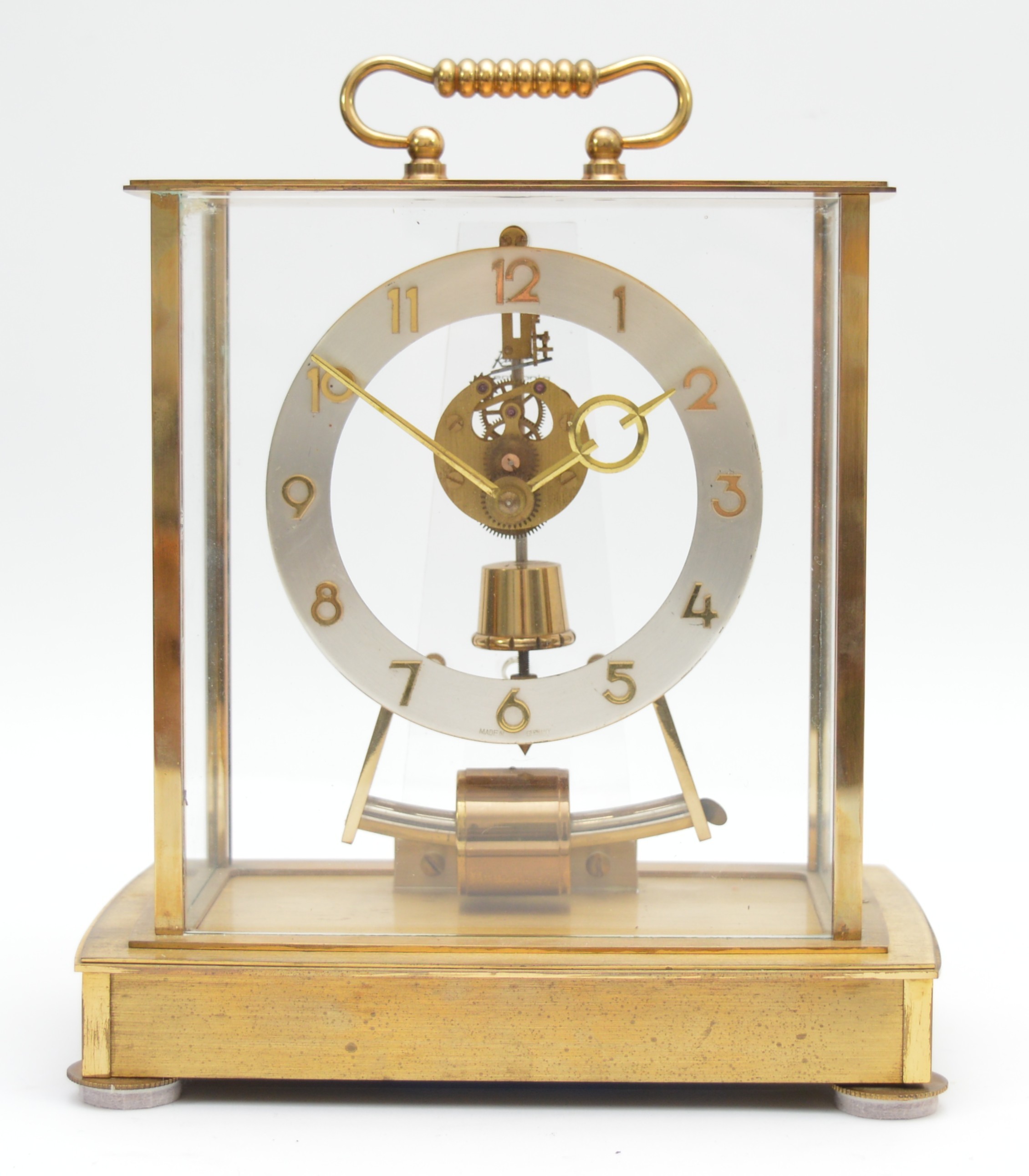 A 1960s Kundo 'Electronic' skeleton mantel clock with Arabic numerals ...