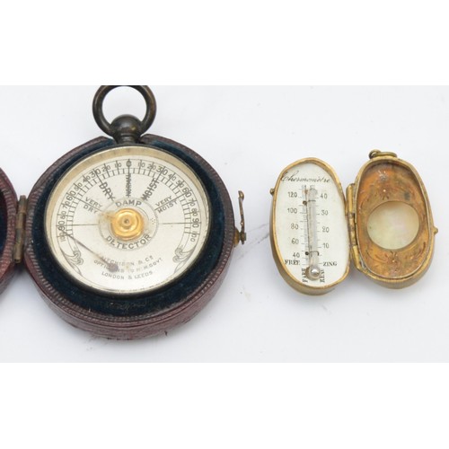 A 19th century Continental novelty thermometer, housed in a shell with ...