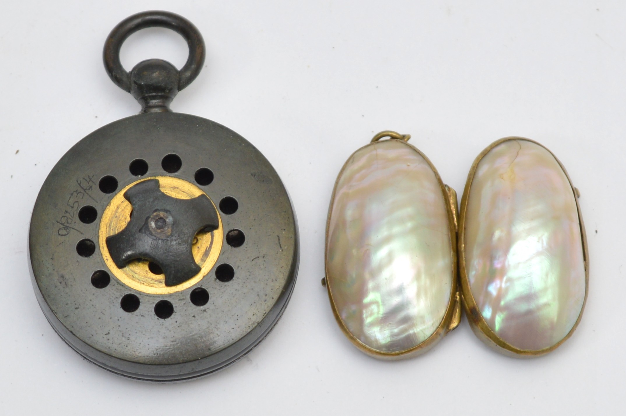 A 19th century Continental novelty thermometer, housed in a shell with ...
