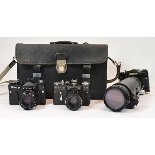 Three Zenit cameras, a Zenit 12XP with a Helios-44M-4 f/2 58mm lens, a ...