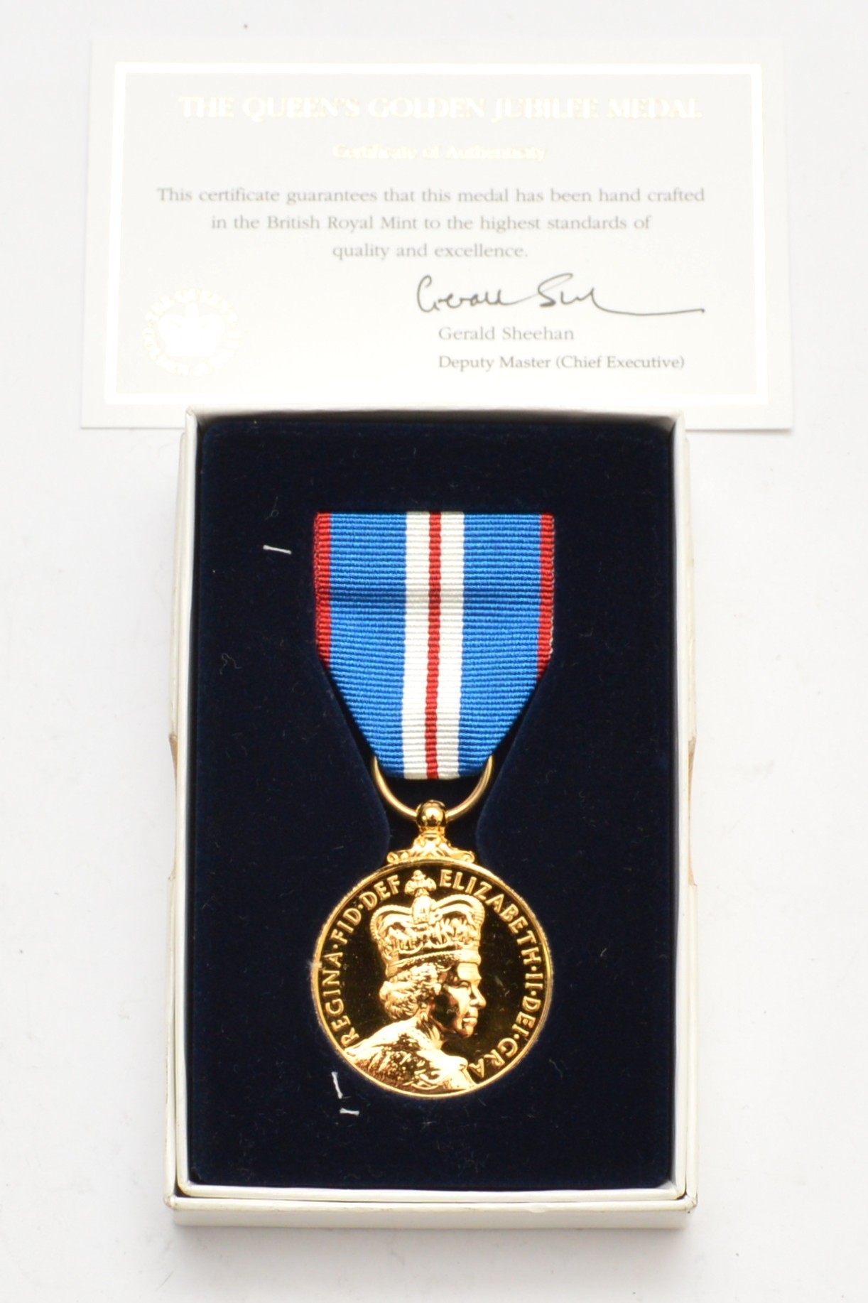 A boxed Elizabeth II Golden Jubilee medal.