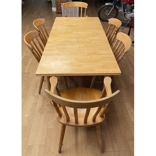A modern pine extending dining table with a set of six (4+2 carvers ...