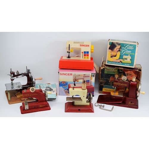 A collection of six childrens sewing machines, boxed and loose to ...
