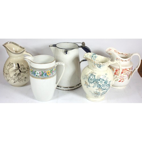 Five large pitchers, to include, rustic white enamel pitcher, possibly ...