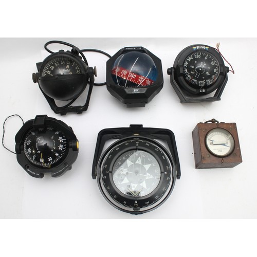 A group of five ships compasses, to include Contest 130, Selestral ...